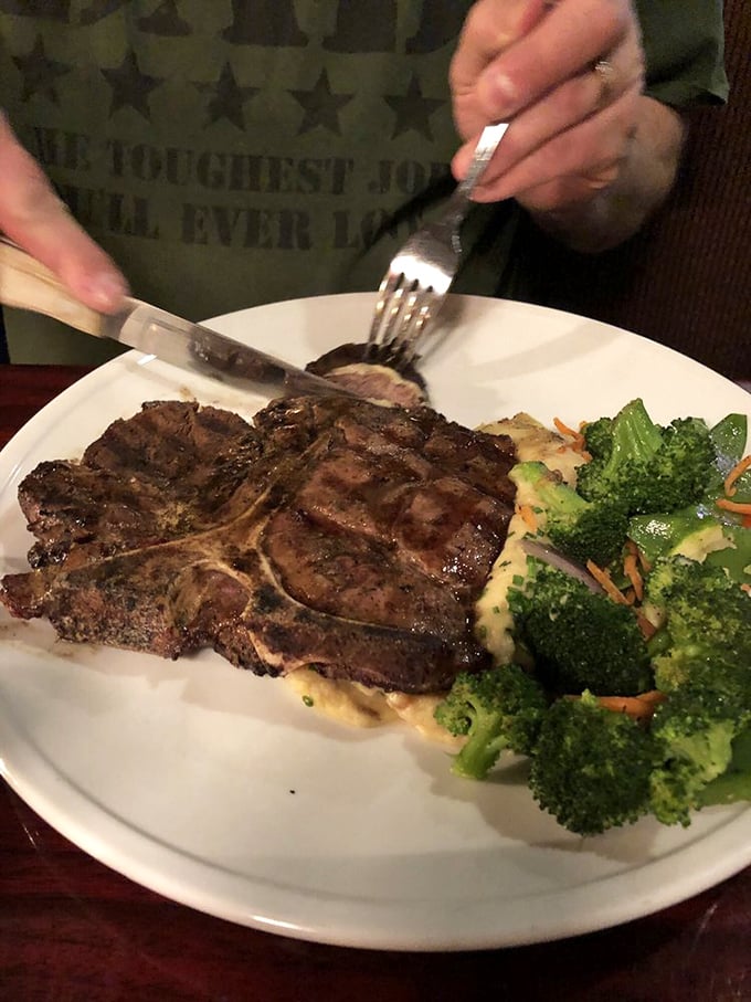 When a knife slides through porterhouse this perfectly, you know you've found steak nirvana. The broccoli's just there for color.
