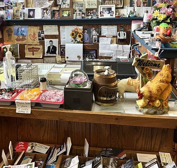 This isn't just a cash register—it's command central where candy treats tempt the young while a chicken figurine stands guard over daily operations.