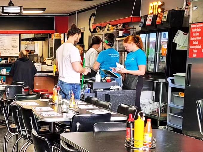 The heart of operations – where orders are taken, memories are made, and the staff moves with the efficiency of people who truly love what they do.