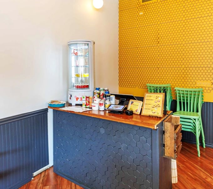 The honeycomb-patterned counter and sunny yellow wall create a visual reminder of what makes this chicken so special—it's all about the honey, honey.