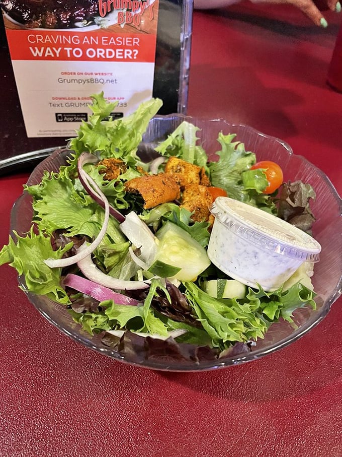 Even the salad gets the Grumpy's treatment—fresh, colorful, and substantial enough to hold its own on a table dominated by meat.