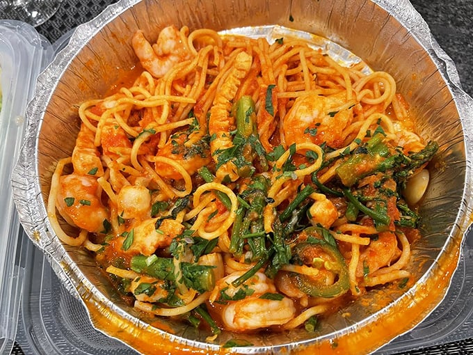 This seafood pasta isn't just dinner—it's an undersea gathering where shrimp, vibrant herbs, and tomato sauce throw the party of the year.