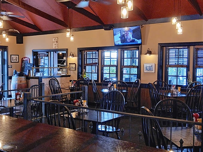 Windsor chairs and wooden tables create that perfect "come as you are" vibe where both date night and family dinner feel equally at home.