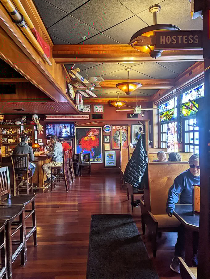 Wood paneling, vintage posters, and the promise of burger bliss. This isn't just restaurant seating—it's a time machine to when flavor mattered most.