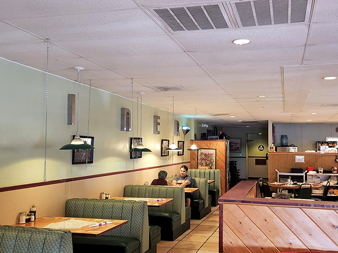Green booths line the walls like old friends waiting to catch up over coffee and eggs that never disappoint.