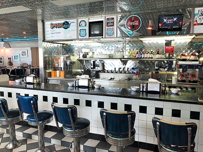 The heart of operations—where orders are called, coffee is poured, and the rhythmic dance of diner service has been perfected over countless mornings.