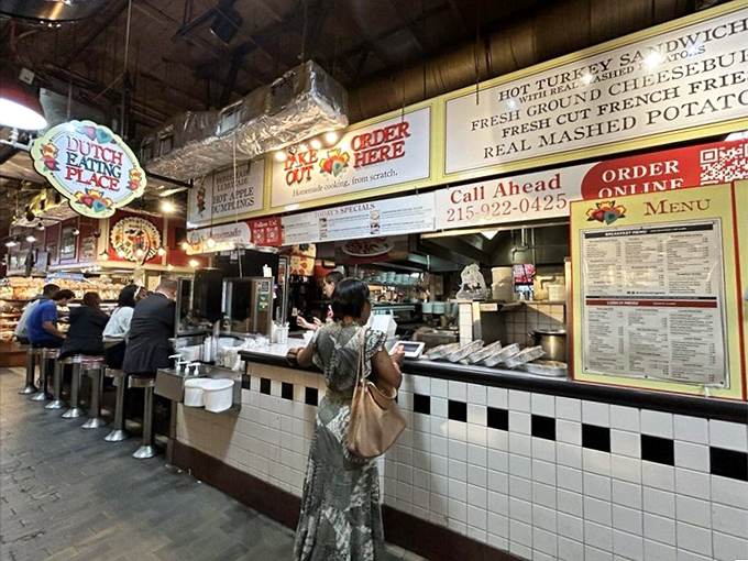The ordering window: where breakfast dreams begin their journey to reality. That line isn't just people waiting—it's a testament to food worth standing for.