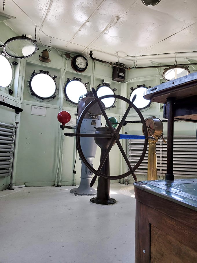 The ship's wheel stands ready, as if the captain just stepped away for a coffee break and might return any minute to guide this vessel home.