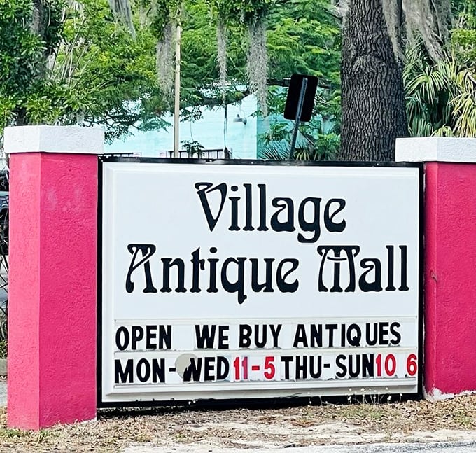 The sign stands as a cheerful landmark, beckoning travelers with promises of discoveries that big-box stores simply cannot deliver.