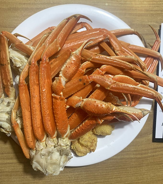 Snow crab legs arranged like nature's perfect puzzle—requiring equal parts strategy, determination, and melted butter to solve.