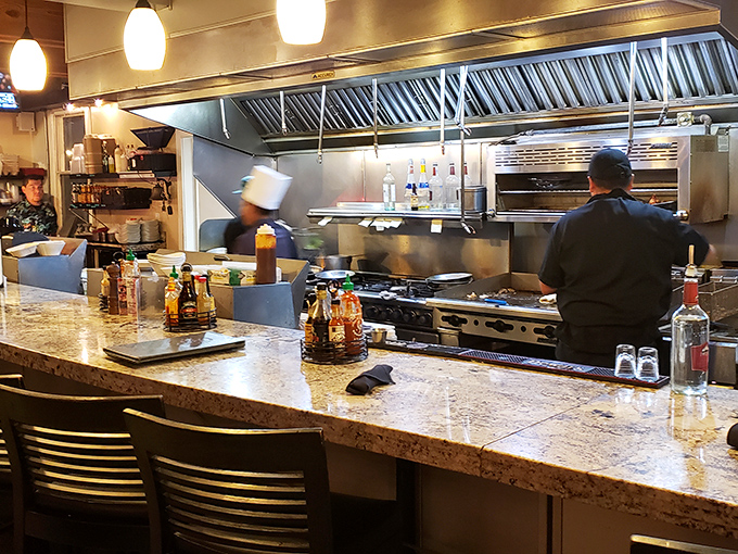 Where the magic happens—chefs in their natural habitat. The open kitchen design means dinner and a show come standard with every meal.