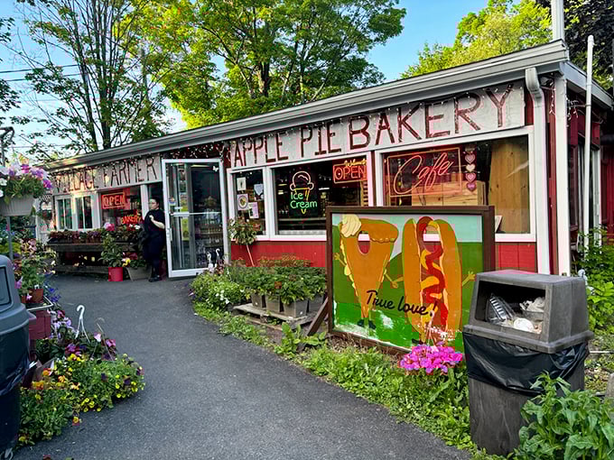 The exterior comes alive with neon signs promising "OPEN" and "Cafe"—two of the most beautiful words in the English language when you're hungry.