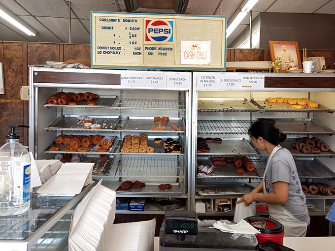The quiet ballet of donut service—practiced hands ensuring that Maryland mornings start with the right balance of sugar, dough, and happiness.