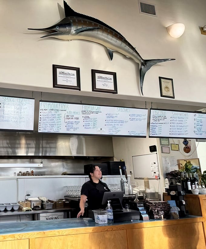 Another view of the ordering counter where seafood dreams begin their journey to your table, overseen by that watchful marlin.