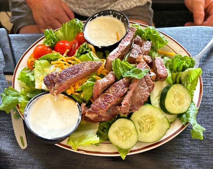 This steak salad proves healthy-ish eating doesn't mean sacrifice—perfectly seared beef atop fresh greens with not one but two dipping sauces.