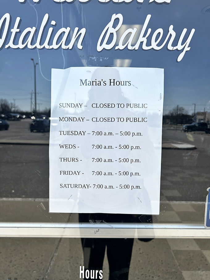 Maria's hours posted clearly—because knowing when you can get your hands on that lasagna is essential life information. Plan accordingly!