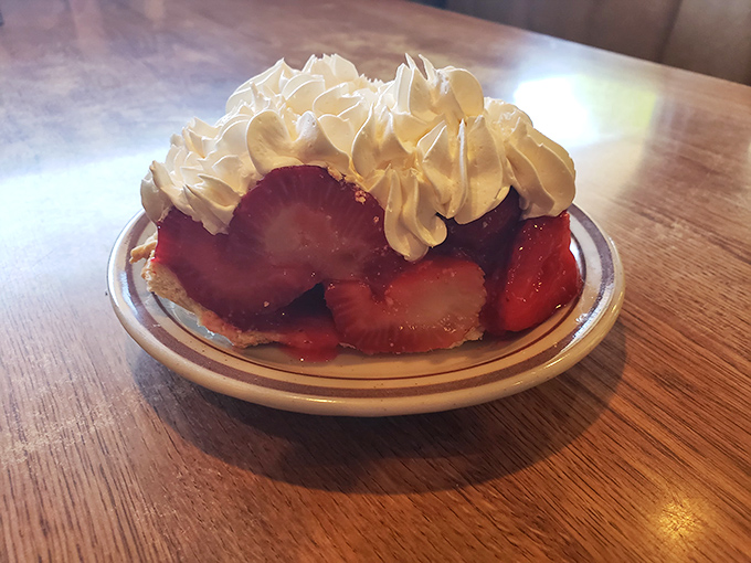 Strawberry shortcake that makes you question why you'd ever waste stomach space on vegetables. That whipped cream crown deserves its own Ohio state flag.