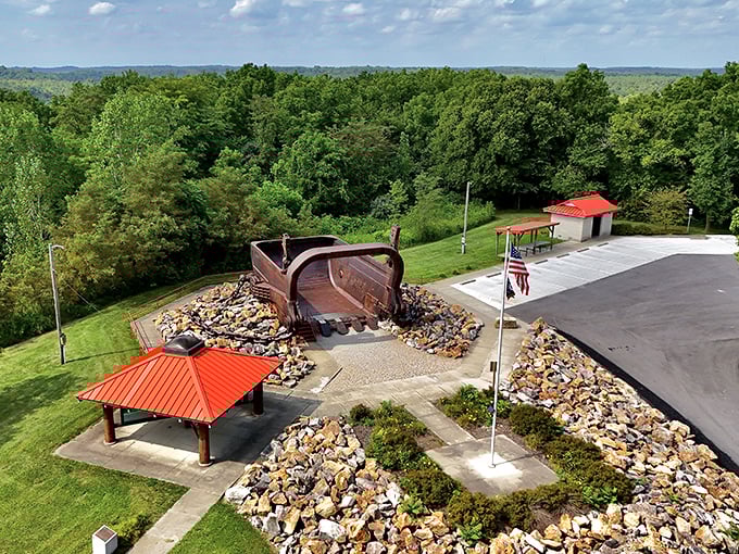 From above, the bucket's massive scale becomes even more apparent, anchoring the memorial park like an industrial-age sculpture garden.