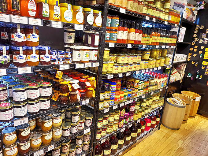A spectrum of preserves and condiments standing at attention—each jar a potential dance partner for the star of the show: cheese.