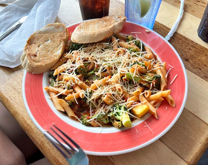 Even the pasta gets the coastal treatment here—a sea of penne swimming with vegetables and cheese that would make an Italian grandmother nod approvingly.