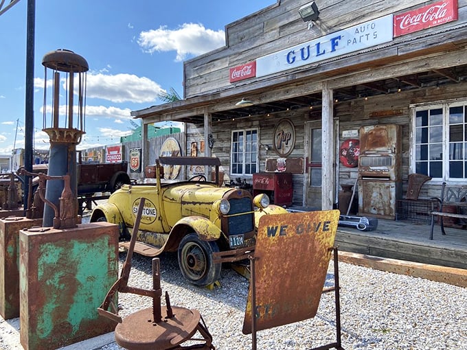 This isn't just vintage – it's automotive archaeology. A yellow delivery truck rests beside rusty gas pumps, telling tales of America's highway heyday.