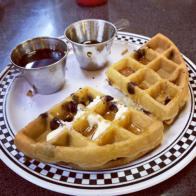 Waffles with perfect grid precision – those squares were designed by breakfast engineers to hold maximum butter and syrup.