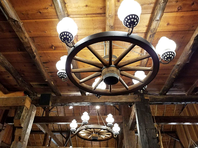 Not just lighting – a conversation piece. This wagon wheel chandelier transforms ordinary dining into a rustic celebration of American ingenuity.