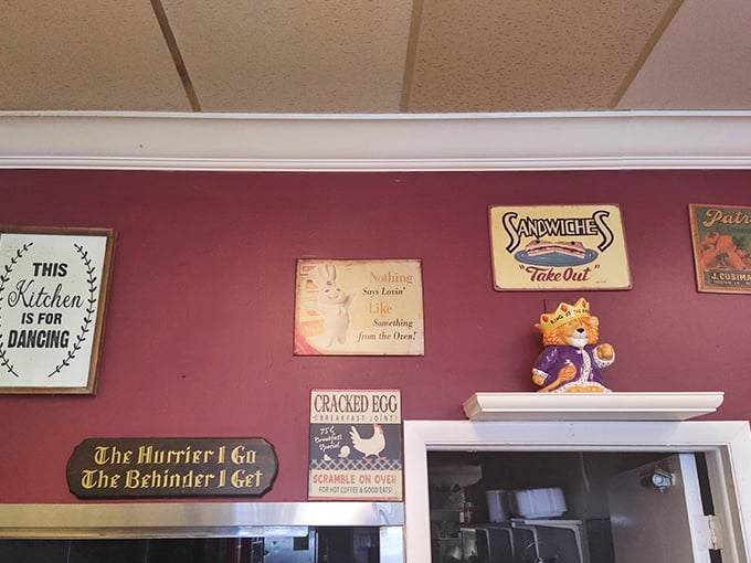 Wall décor that tells you everything you need to know: "This Kitchen is for Dancing" and "The Hurrier I Go, The Behinder I Get."