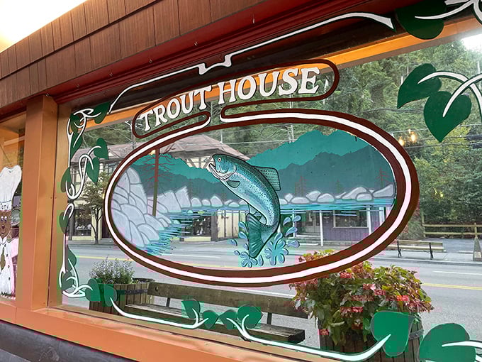 This artful window decoration captures the spirit of the place – a leaping trout against mountain scenery, promising the freshest catch this side of catching it yourself.