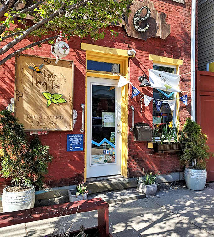 Abeille Voyante Tea Co. brings a splash of color to Millvale's brick-lined streets, inviting passersby to "take a moment & Bee Well" in this charming tea shop.