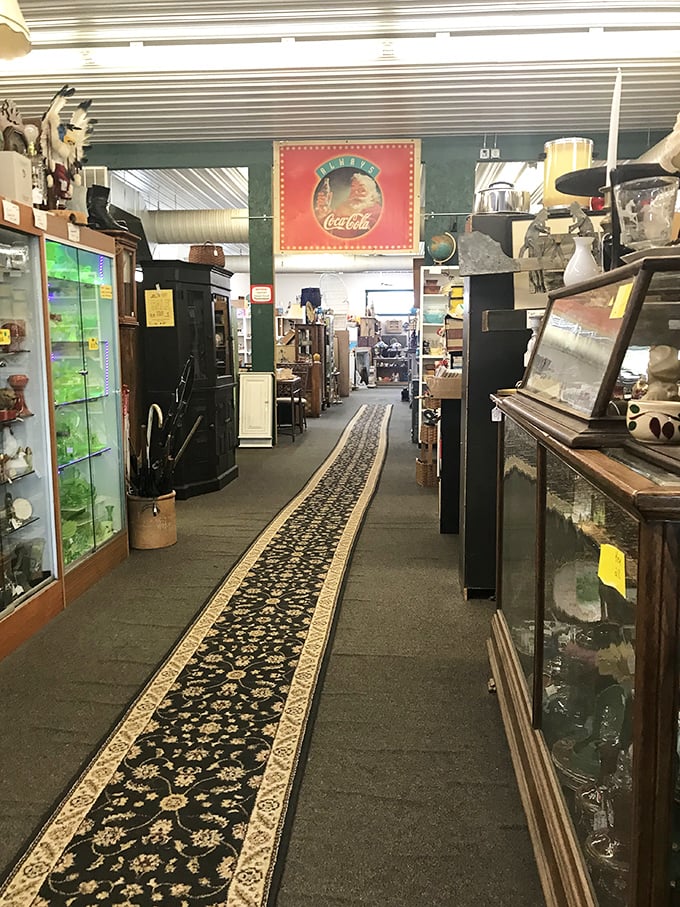 Walking these aisles feels like exploring your eccentric uncle's attic—if your uncle collected everything from crystal stemware to vintage signage.