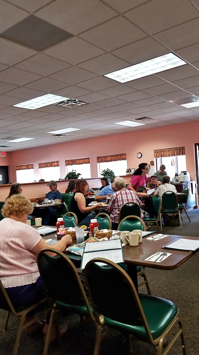 The dining room buzzes with conversation and clinking silverware – the soundtrack of community happening over coffee cups.