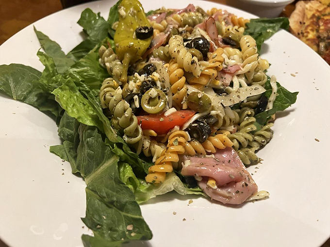 Tri-colored pasta salad with all the Mediterranean fixings—proof that "salad" doesn't have to be a four-letter word in the culinary sense.