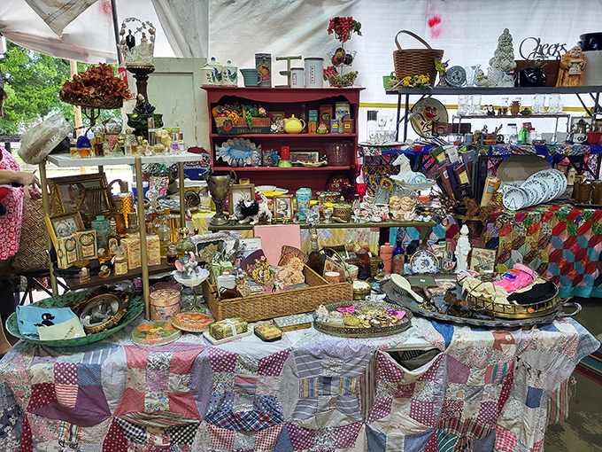 Treasure hunting at its finest! This vendor's carefully curated chaos of vintage collectibles sits atop a handmade quilt – it's nostalgia squared.