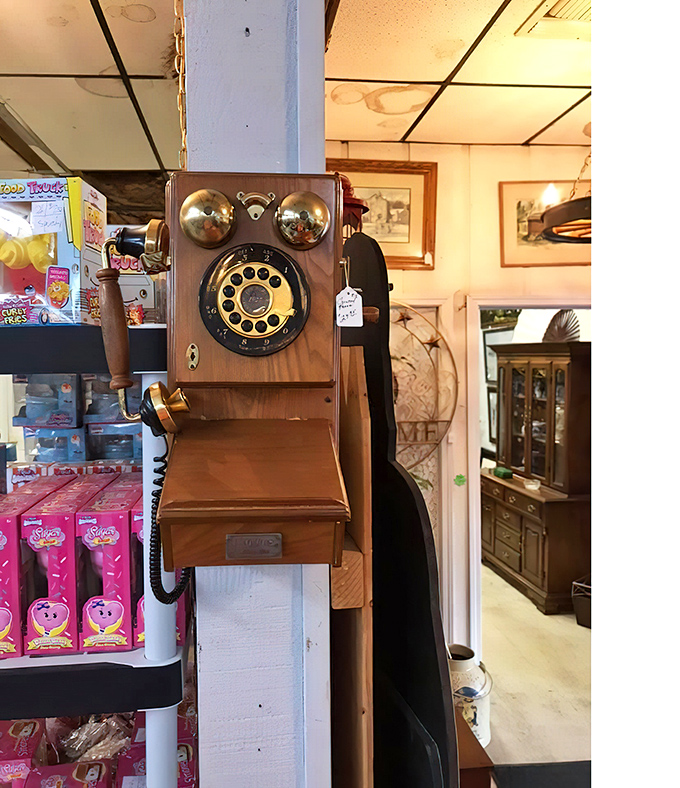 This wooden wall phone has heard more gossip than a small-town diner. Rotary technology that makes smartphones seem soulless by comparison.
