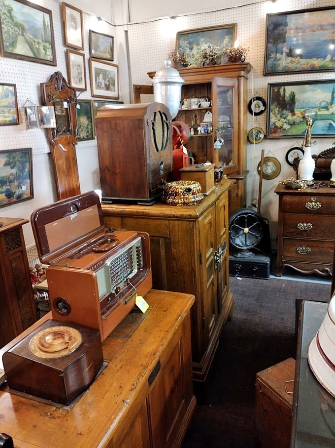 Vintage radios and wooden furniture create a time capsule corner. That cabinet probably announced the end of WWII to its original owners.