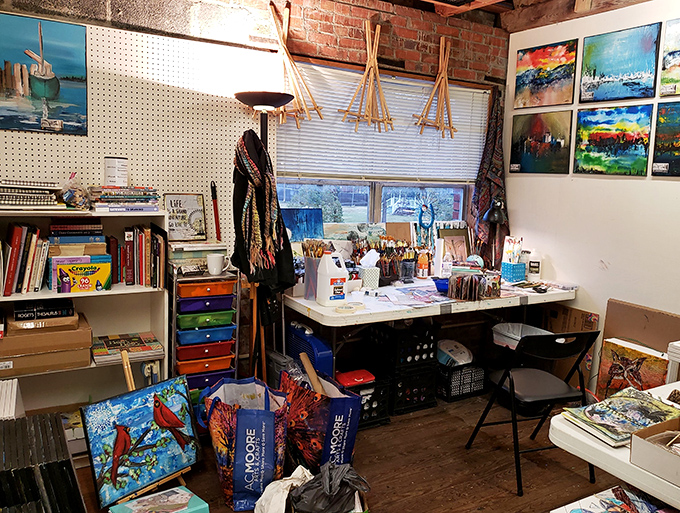 An artist's corner where creativity flows as freely as the paint—brushes stand ready for their next masterpiece amid colorful inspiration.
