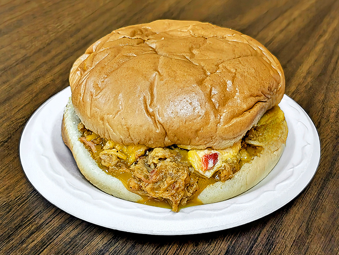 This isn't just a BBQ sandwich – it's a Southern hug on a bun, complete with that signature pimiento cheese embrace.