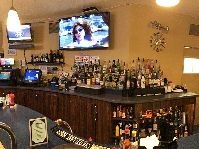The bar area stands ready for evening revelry – proof that Waffle Hut & Eatery understands life's greatest pleasures don't end when breakfast service concludes.