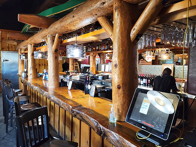 The bar's rough-hewn log construction wasn't just designed—it was crafted with the same attention to detail as their steaks. Those bar stools have supported countless "just one more" decisions.