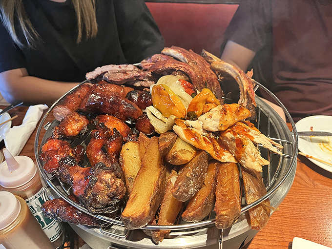 The barbecue platter arrives like a meaty Mount Rushmore—a monument to smoke, time, and the pursuit of happiness.