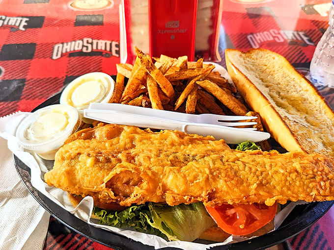 This fish is so perfectly golden, it belongs in Fort Knox. The crunch echoes through the train car like a conductor's announcement.