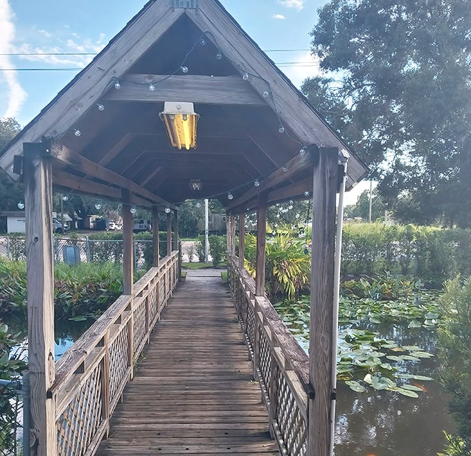 This wooden bridge doesn't just connect parking to restaurant—it's a literal passage from the ordinary world into a realm of extraordinary flavor.
