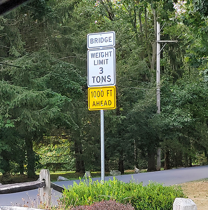 Modern safety meets historic preservation—a weight limit sign ensures this 19th-century marvel will welcome visitors for generations to come.