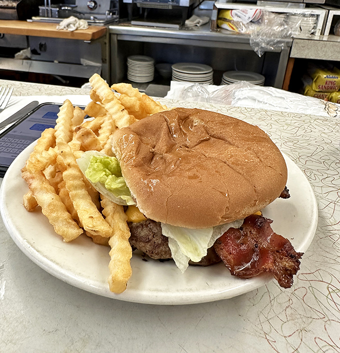 The bacon cheeseburger and crinkle-cut fries—a duo more iconic than Batman and Robin, and infinitely more satisfying.