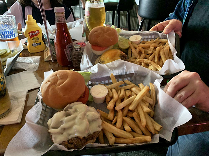 Burgers served in baskets lined with paper—no pretentious plates needed when the food speaks this eloquently.