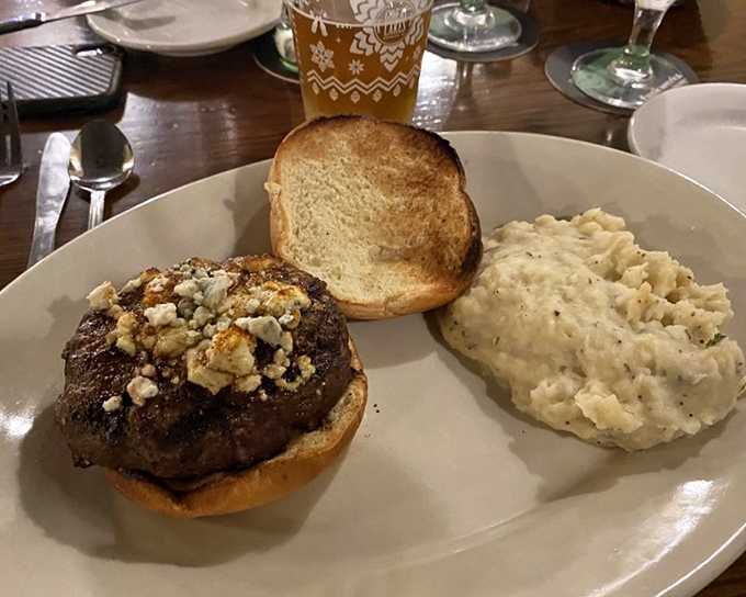 This isn't just a burger – it's architecture with flavor. The blue cheese and toasted bun create a perfect foundation for beef brilliance.