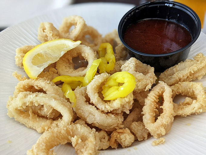 Crispy calamari rings with banana peppers—the ocean's tastiest jewelry, perfectly accessorized with a tangy dipping sauce.