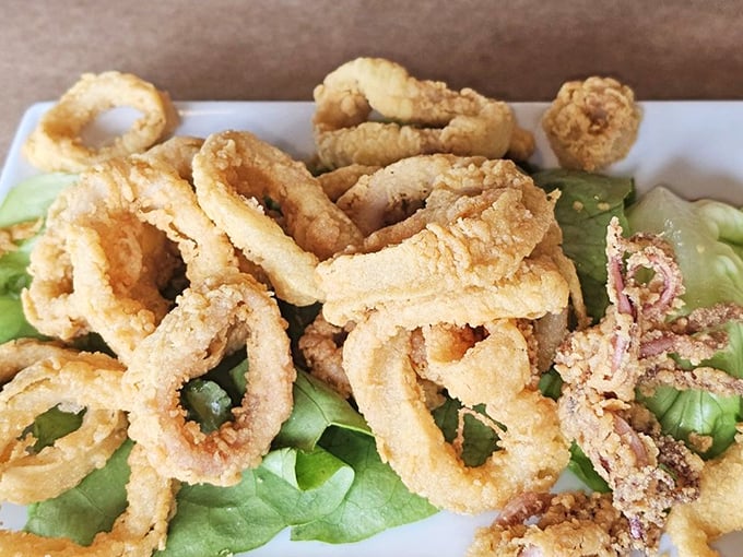 Calamari so perfectly fried, even squid skeptics become instant converts. These golden rings deserve their own finger-licking fan club.