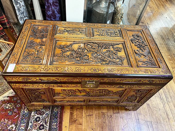 This isn't just a wooden chest—it's a masterpiece of carved storytelling, each panel a chapter in an epic tale told through patient craftsmanship.